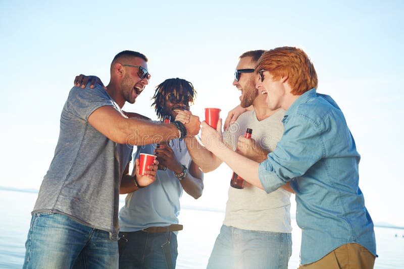 Guys on the beach stock photo. Image of restful, drink - 92349454