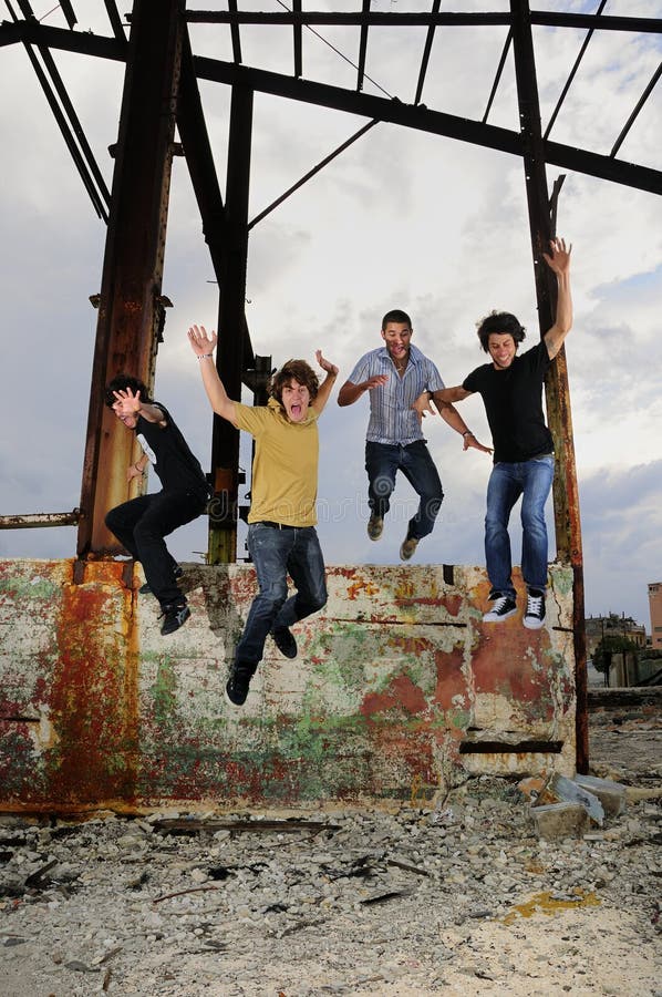 Guys jumping stock image. Image of casual, jumping, group - 10021143