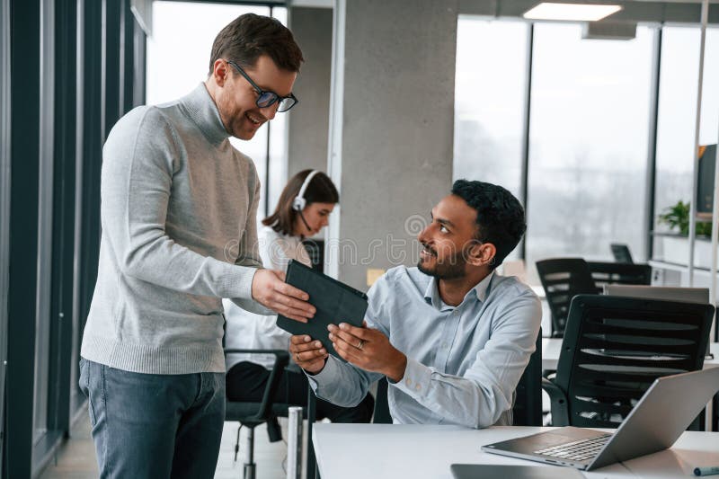 Guys are Talking with Each Other. Men and Woman are Working in the ...