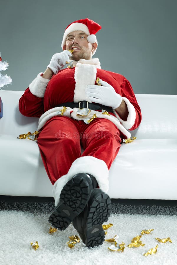 Obese Fat Boy in Santa Claus Suit Holding Gift Box and Laughing Stock ...