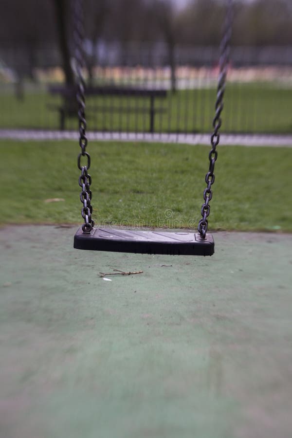 Spooky Child`s Swing in a Play Park Stock Image - Image of chills, cold ...