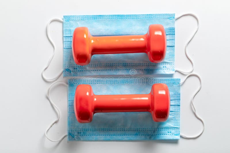 Gym in Coronavirus Restriction. Dumbbells and Blue Mask Stock Photo ...