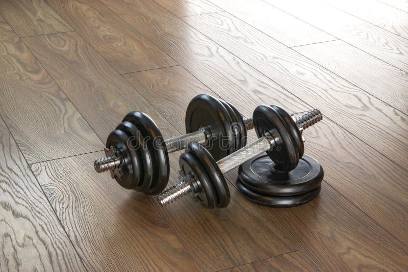 Gym dumbbell on the floor stock image. Image of metal - 269317821
