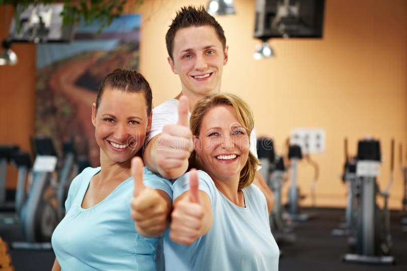 Gym Employees Holding Thumbs Up Stock Image - Image of high, machine ...
