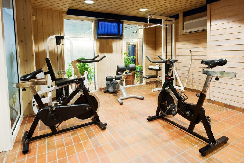 Fitness Equipments in a Gym Stock Photo - Image of light, equipments ...