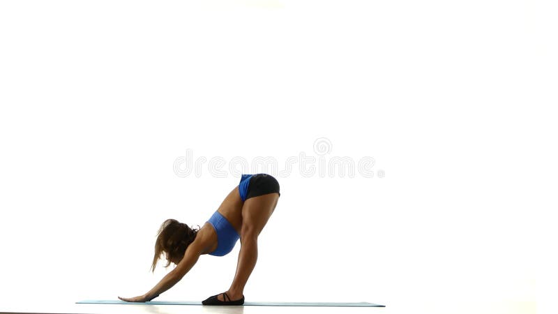 Athlete Does the Splits and Tilt the Body Forward. White Stock Footage ...