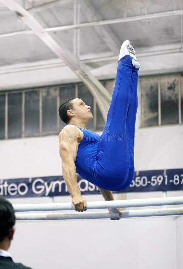 Gymnast on parallel bars stock image. Image of compete - 103853