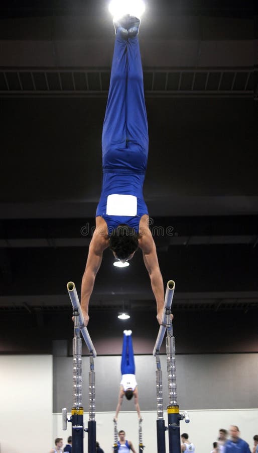 Gymnast on parallel bars stock image. Image of compete - 103853