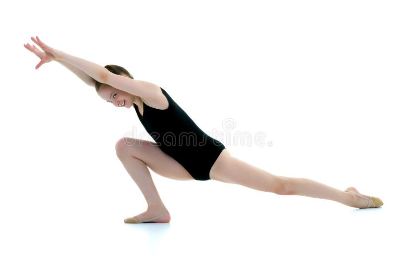 The Gymnast Perform an Acrobatic Element on the Floor. Stock Photo ...