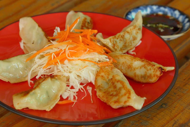 Gyoza in a Red Plate on a Table Stock Image - Image of asian, japan ...