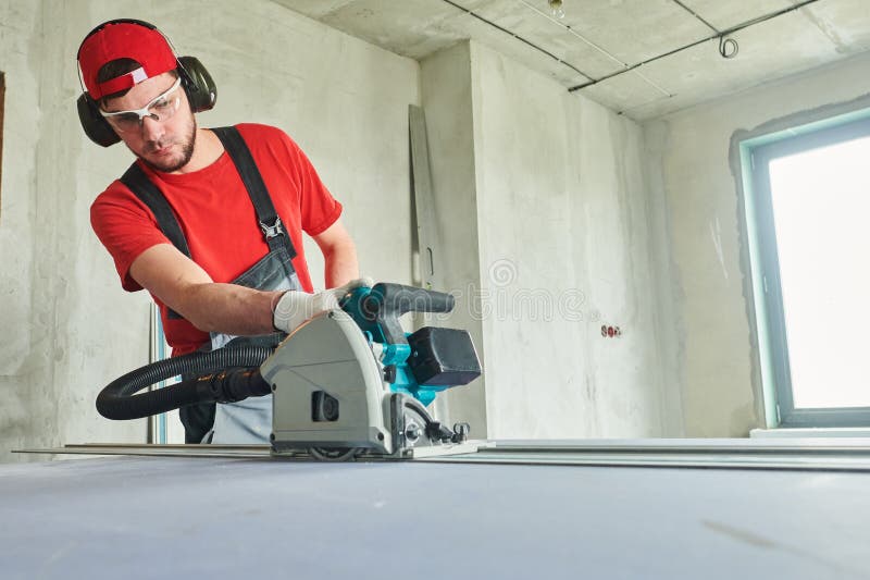 Drywall Construction at Home. Contractor Worker Milling Gypsum ...