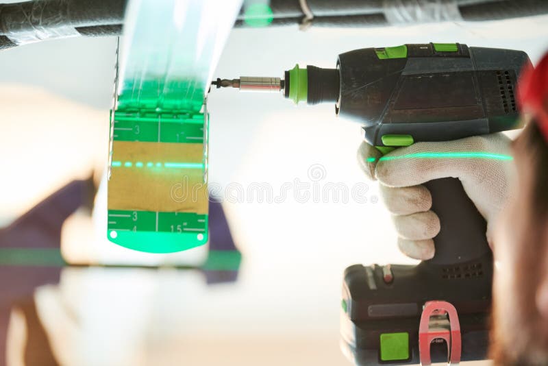 Drywall Construction at Home. Contractor Worker Sawing Gypsum ...