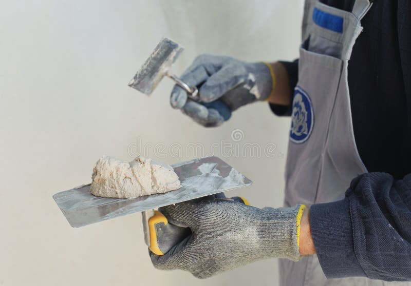 Gypsum puttying manually. stock image. Image of addition - 48718725