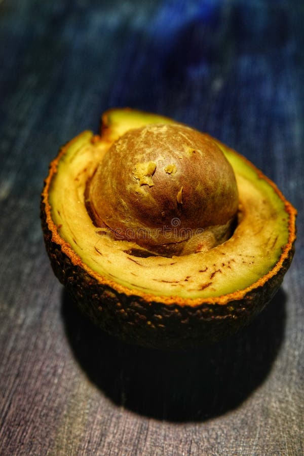 Haas Avocado Cutted in Half Stock Photo - Image of shadow, cutted ...