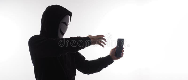 Hacker Anonymous and Face Mask with Smartphone in Hand Stock Image ...