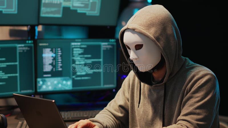 Hacker with Anonymous Mask Breaking Security System Stock Footage ...