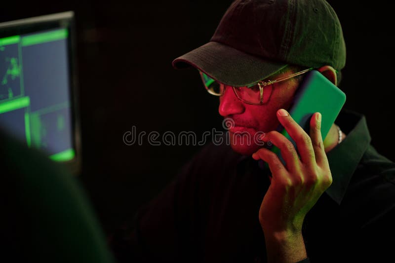 Hacker Talking on Phone stock image. Image of security - 269925781