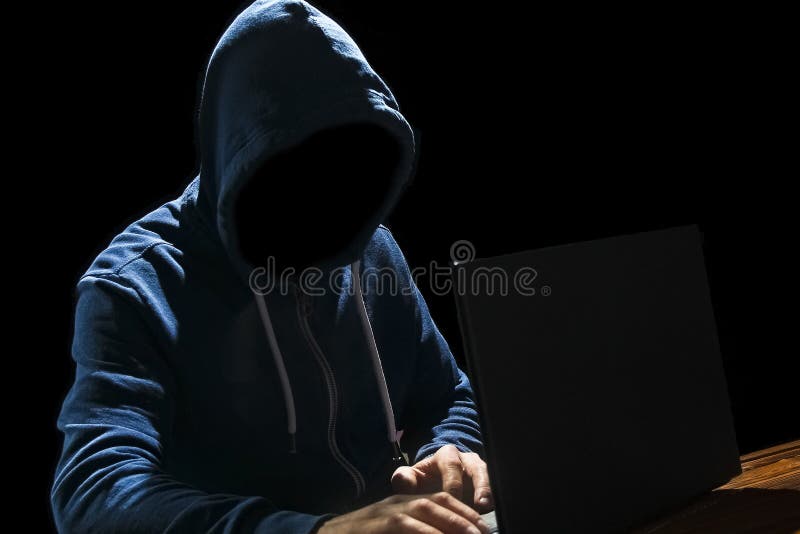 Hacker with Computer Man Sitting at a Table in a Hood Stock Image ...