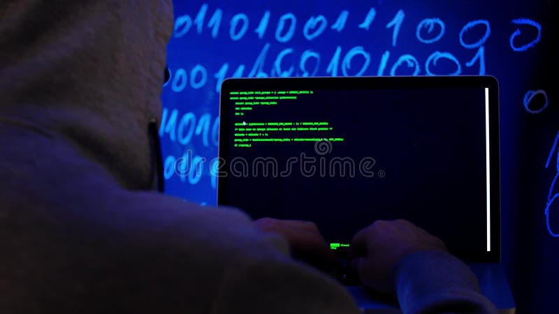 Hacker in Dark Room Writing Programming Code or Using Virus Program for ...