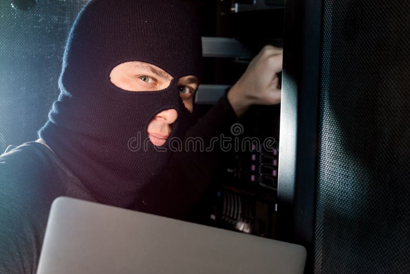 Hacker in a datacenter stock photo. Image of internet - 67576036