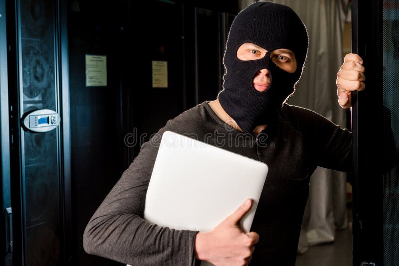 Hacker in a datacenter stock image. Image of adult, internet - 67880385