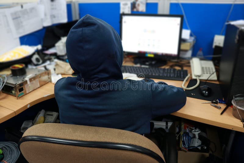 A Hacker in Front of a Computer is Doing His Job Stock Photo - Image of ...