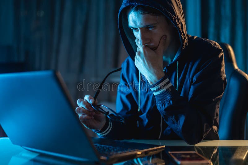 Hacker In Glasses Thinking About The Problem Of Hacking And Stealing Access Databases With