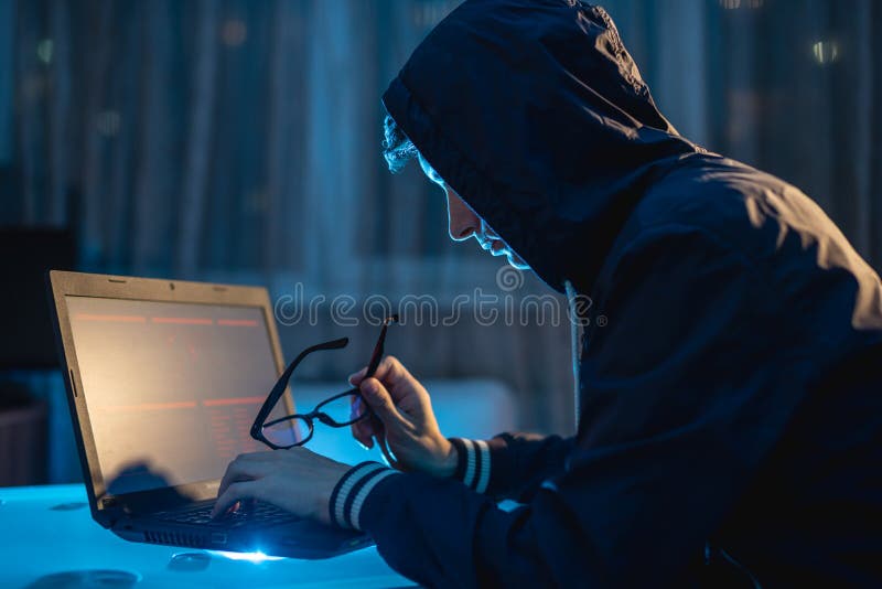 Hacker In Glasses Thinking About The Problem Of Hacking And Stealing Access Databases With