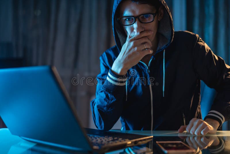 Hacker In Glasses Thinking About The Problem Of Hacking And Stealing Access Databases With