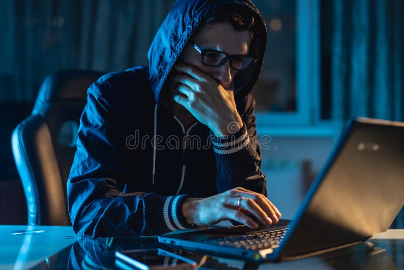Hacker In Glasses Thinking About The Problem Of Hacking And Stealing Access Databases With