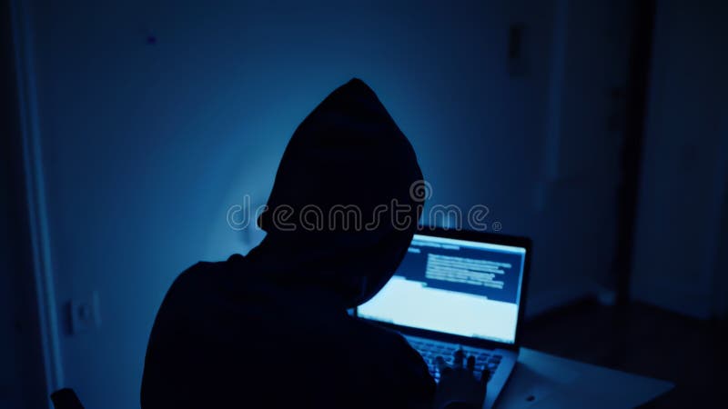 Hacker Hacks Programs. Computer Scammer. Programmers Working Intently on Laptop, Typing in Dark ...