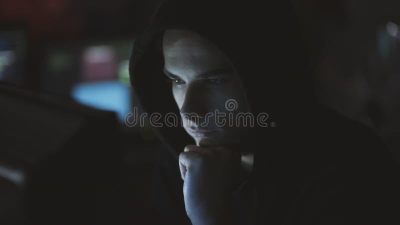 Hacker Hiding in the Dark and Working with Computers Stock Photo ...