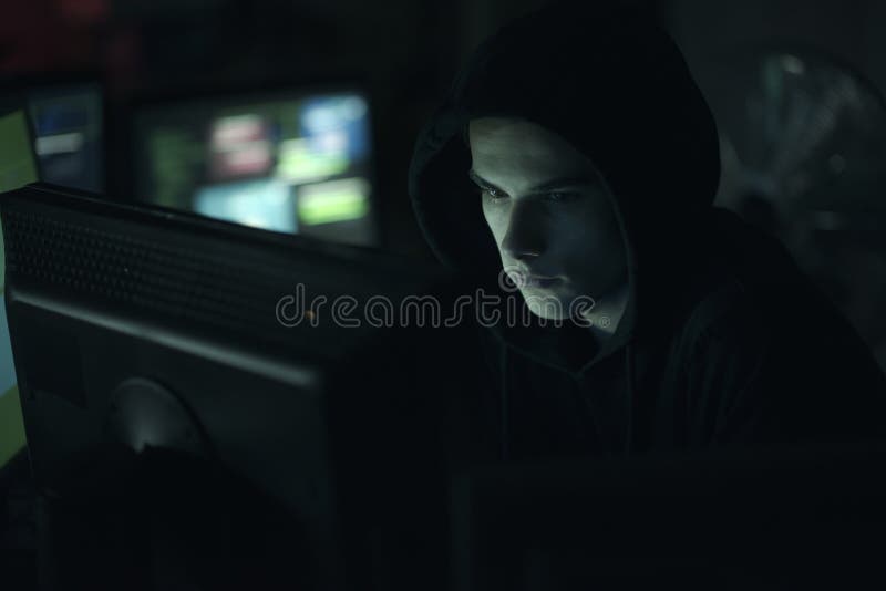 Hacker Hiding in the Dark and Working with Computers Stock Image ...