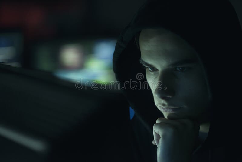 Hacker Hiding in the Dark and Working with Computers Stock Photo ...