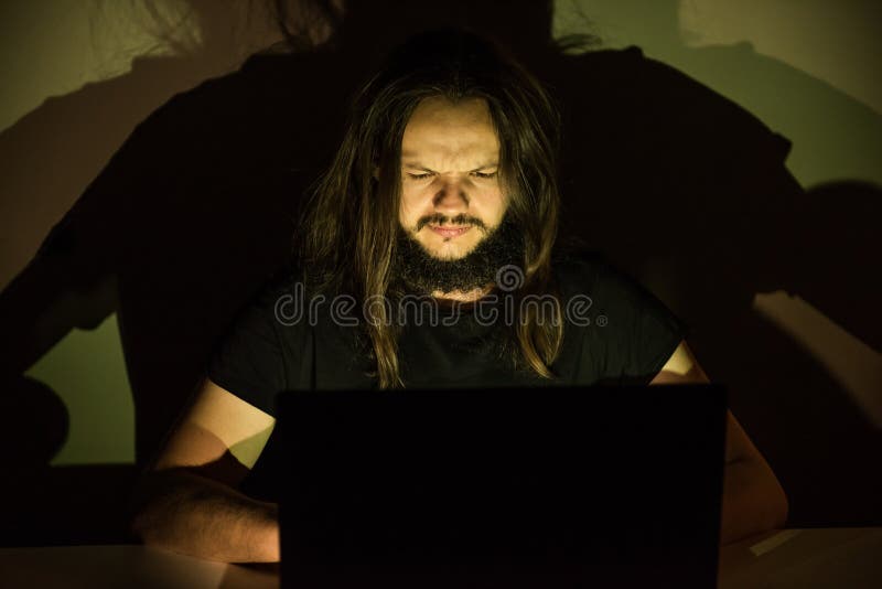 Hacker on His Computer Trying To Enter a Private Porfile Stock Photo ...