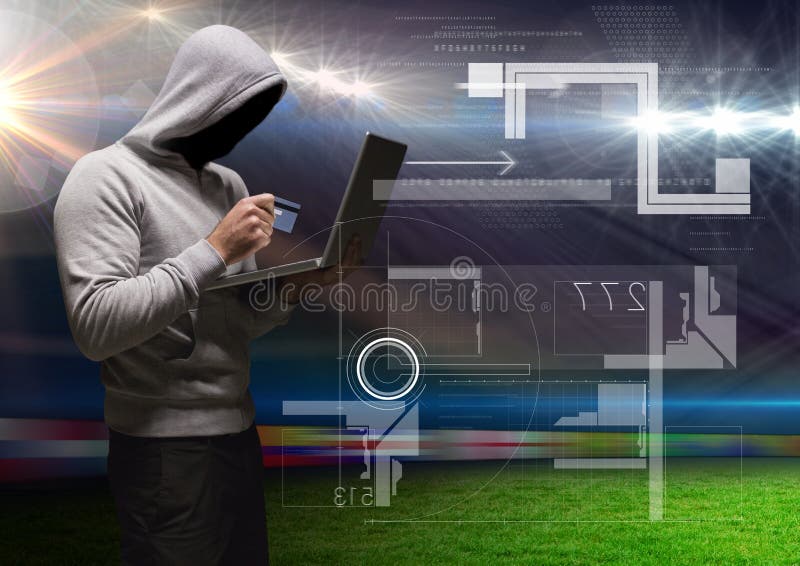 Hacker Holding a Credit Card and Using a Laptop in Front of Grass Field ...