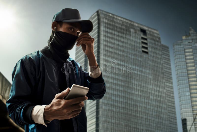 Hacker Holding Mobile Phone Stock Image - Image of dangerous, person ...