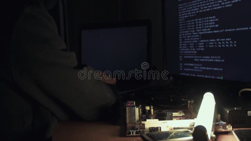Hacker in Hood Cracking Code Using Computers in Dark Room Stock Video ...