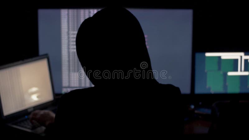 Hacker in Hood Cracking Code Using Computers in Dark Room Stock Video ...