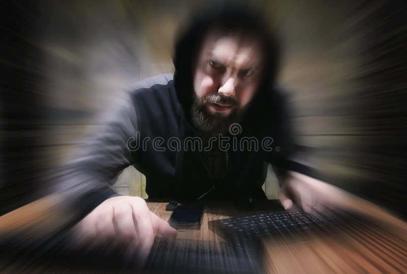 The Hacker in the Hood Sits and Works Stock Image - Image of male ...