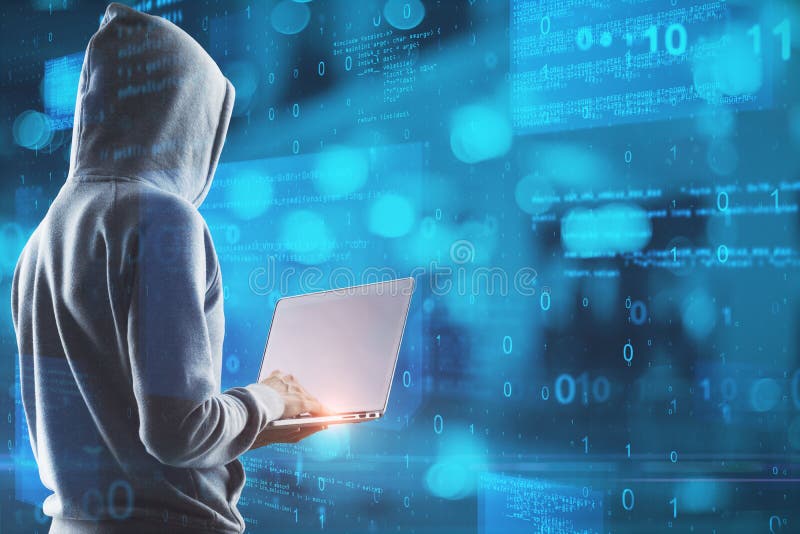 Hacker In Hoodie Using Laptop With Abstract Glowing Blue Coding Background Binary Code Theft