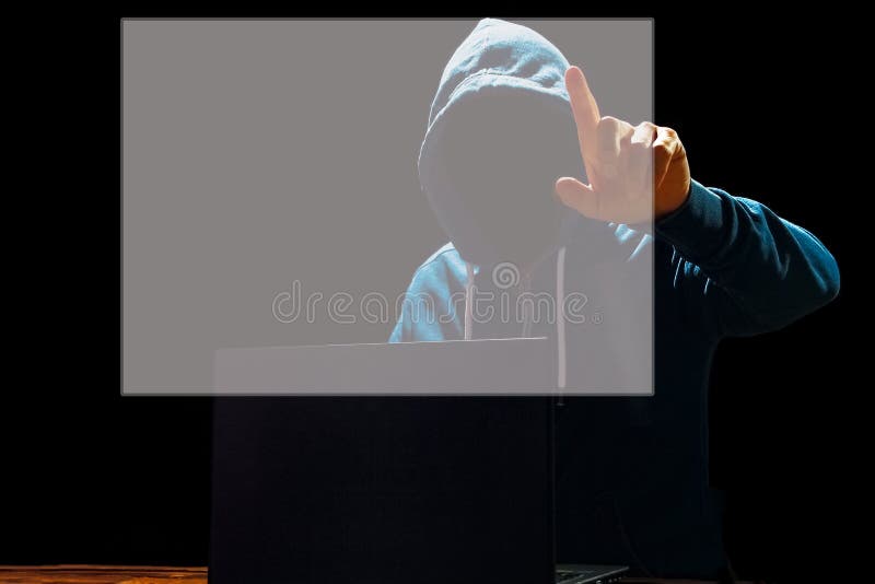 Hacker with Laptop at the Table Breaks into the System Stock Image ...