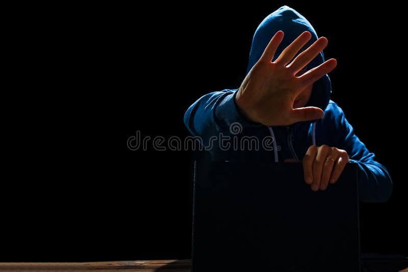 Hacker with Laptop at the Table Breaks into the System Stock Image ...