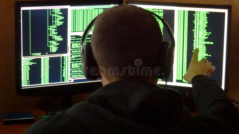 Hacker is Looked To Binary Code. Criminal Hacker Penetrating Network ...