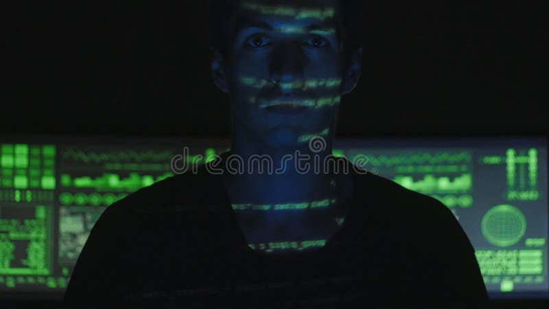 Programmer Hacker Looking at the Camera with Computer, Binary Codes Projections and Animation in ...