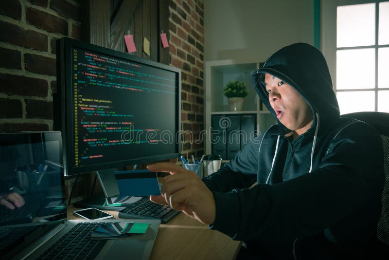 Hacker Looking at Credit Card Feeling Surprised Stock Image - Image of ...