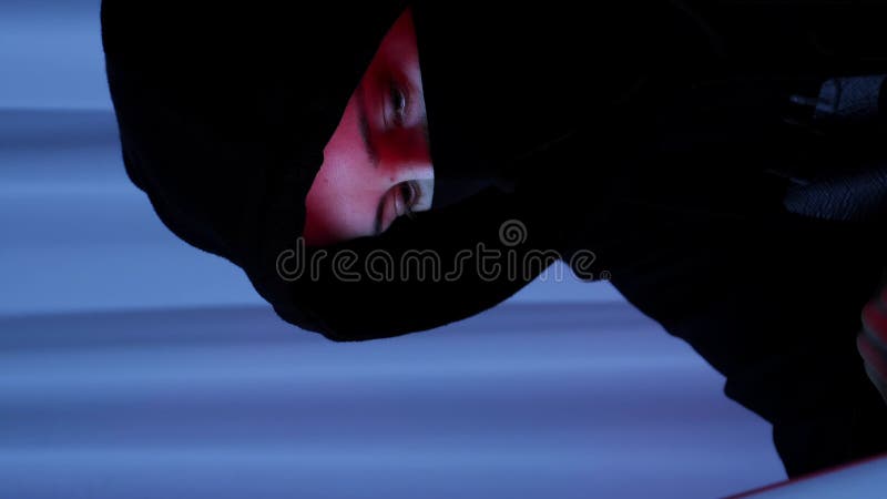 Hacker Looking at Screen and Breaking Password on Computer. Vertical ...