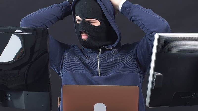 Hacker male in balaclava. stock video. Video of data - 233608461