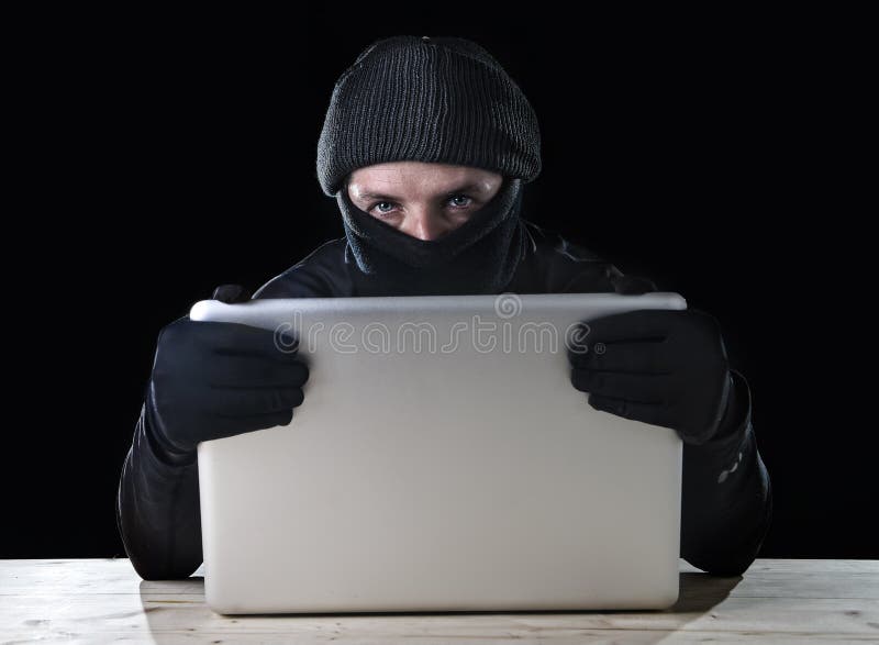 Hacker Man in Black Hood and Mask with Computer Laptop Hacking System ...