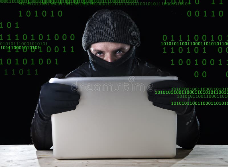 Hacker Man in Black Hood and Mask with Computer Laptop Hacking System ...